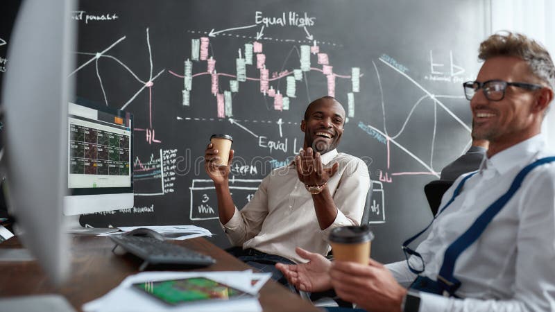 Get a Good Start. Two Diverse Colleagues Traders Discussing Ideas while ...