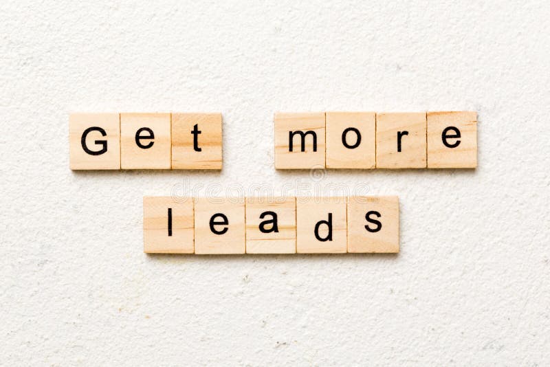 Get More Leads Word Written on Wood Block. Get More Leads Text on Table ...