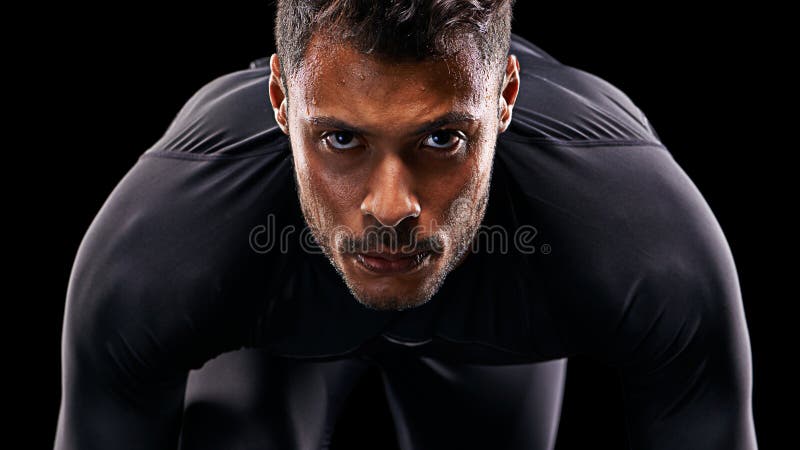 Get Ready. Studio Shot of a Focussed Athlete in the Starting Position ...