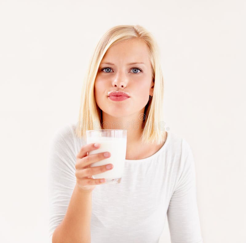 Get Refreshed. Shot of a Young Woman Enjoying a Drink. Stock Photo ...
