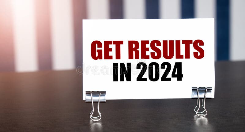 GET RESULTS in 2024 Sign on Paper on Dark Desk in Sunlight. Blue and ...