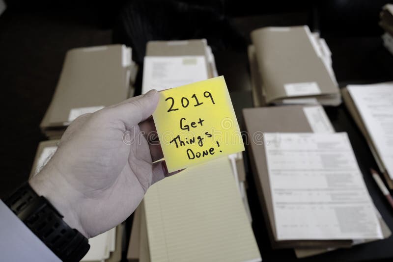 2019 Get Things Done Sticky Note Hand Files on Desk Stock Photo - Image ...