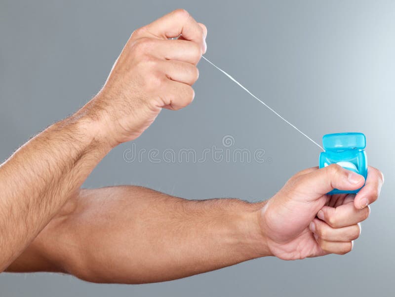 Get To Flossing. an Unrecognizable Man Using Dental Floss. Stock Image ...
