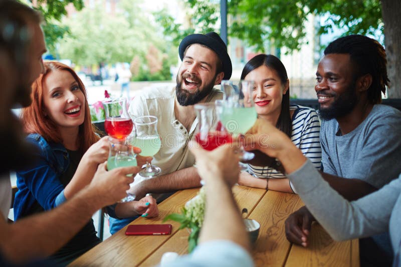 Friends Having Fun and Drinking Cocktails Outdoor on a Rooftop Get ...