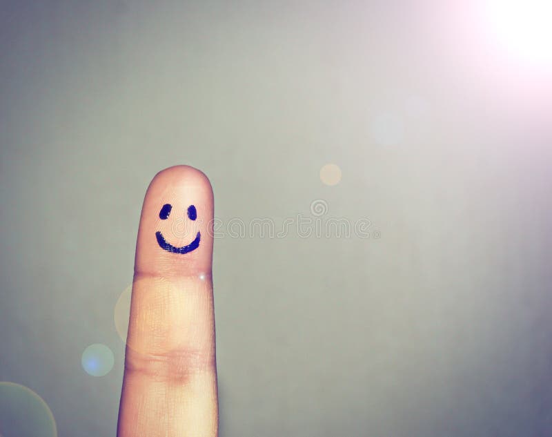 Get Your Happy Face on. Shot of a Finger with a Happy Face Drawn on it ...