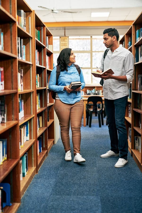 Getting All the Books they Need Around the Library. Two University ...