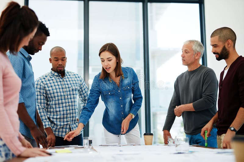 Getting it All Together. a Group of Businesspeople in the Boardroom ...