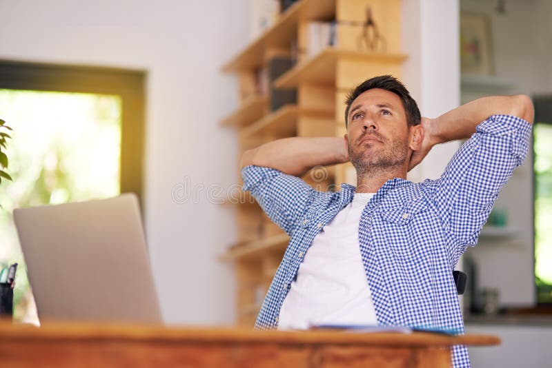 Getting Comfortable in His Home Office. a Young Man Working from Home. Stock Photo - Image of ...