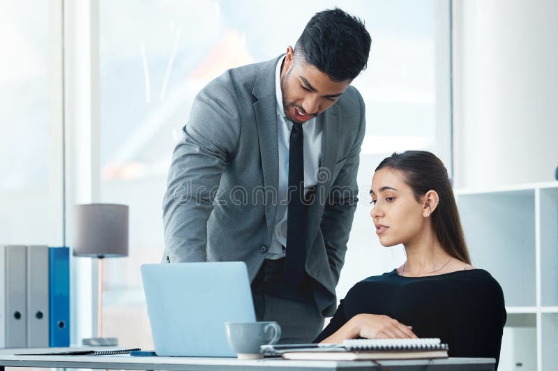 Getting the Deadline Done. Two Businesspeople Working Together on a ...