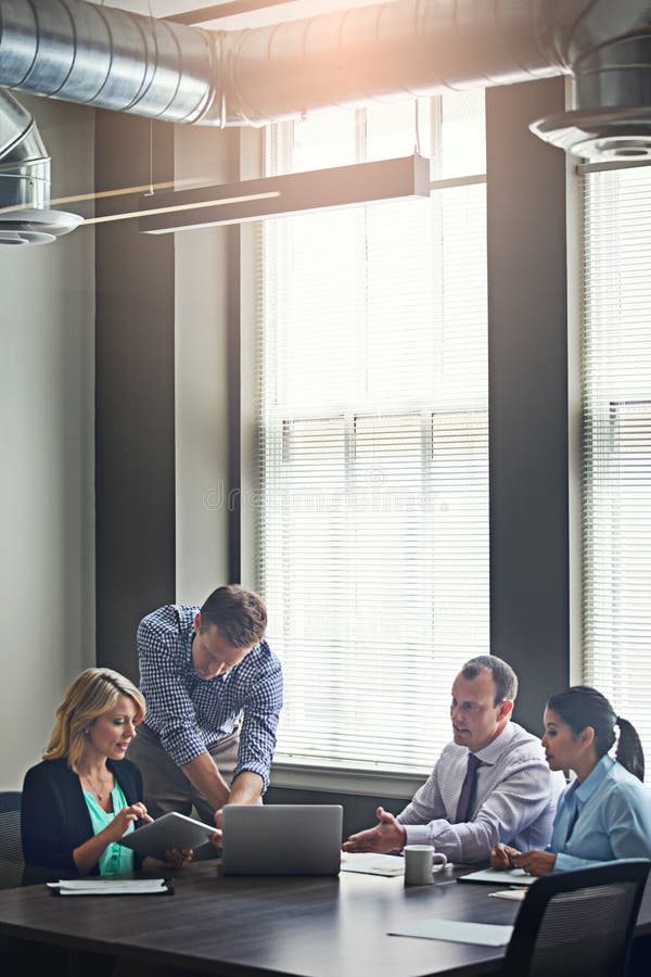 Getting it Done As a Unit. a Group of Colleagues Having a Meeting in ...