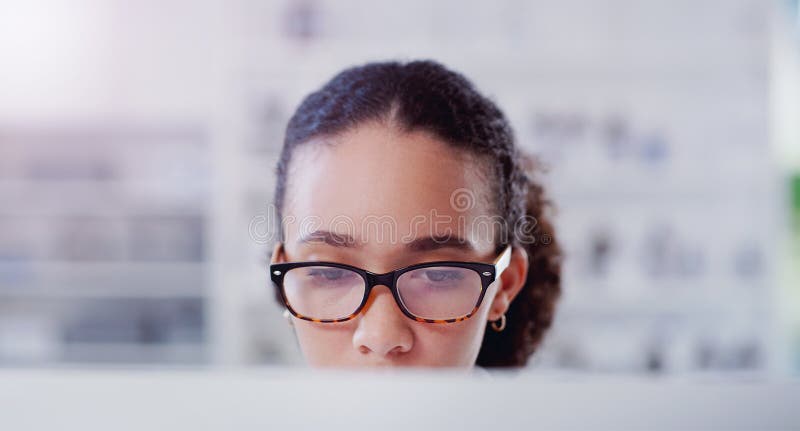 Getting Down To Some Research. a Young Scientist Working on a Computer ...