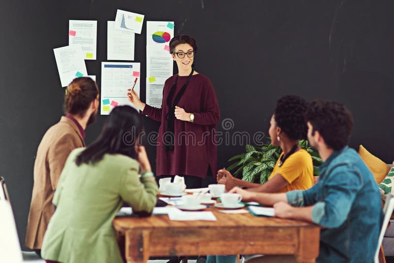 Getting Everyone on the Same Page. a Young Creative Giving a ...