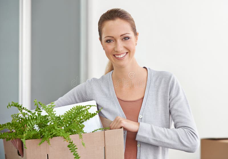 Getting Everything Ready for the Move. a Young Woman Holding a Box with ...