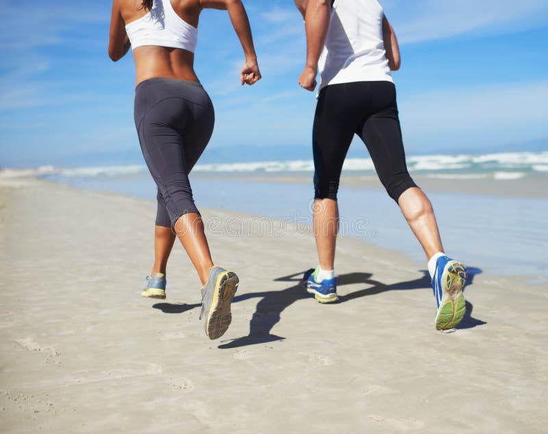 Getting Fit Together. a Couple Running at the Beach. Stock Image ...