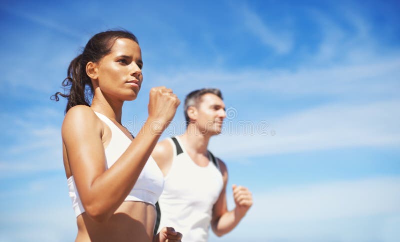 Getting Fit Together. Shot of Two People Running Outdoors. Stock Photo ...