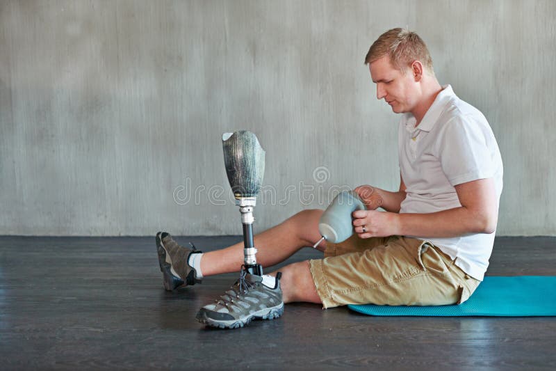 Getting Fit. a Young Amputee Working Out on a Gym Floor. Stock Image ...