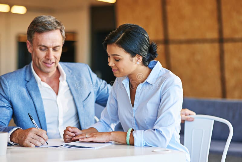 Getting a Fresh Pair of Eyes on Her Work. Smiling Colleagues Working ...