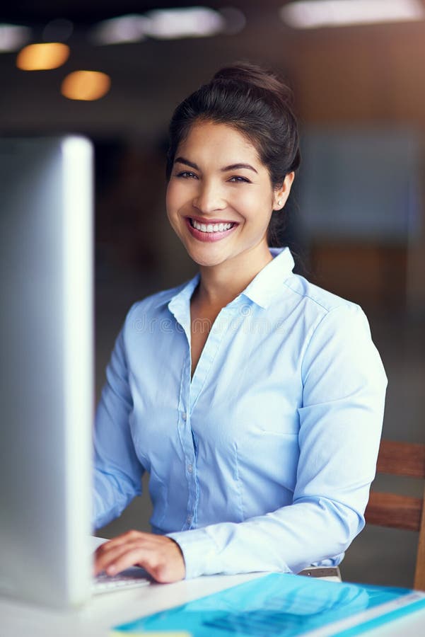 Getting Her Work Done with a Smile. Portrait of a Young Businesswoman ...