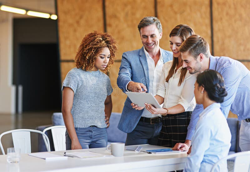 Getting His Managerial Stamp of Approval. a Group of Colleagues Working ...