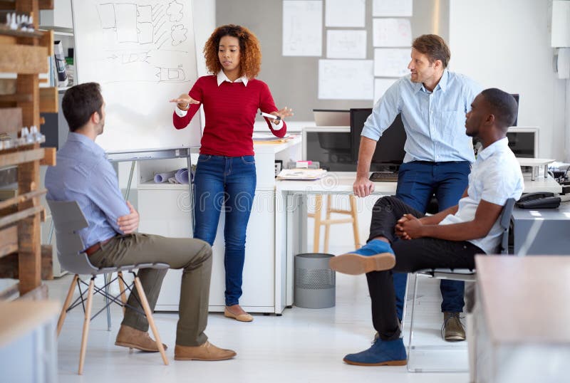 Getting Input from the Crew. a Group of Designers Talking Together in a ...