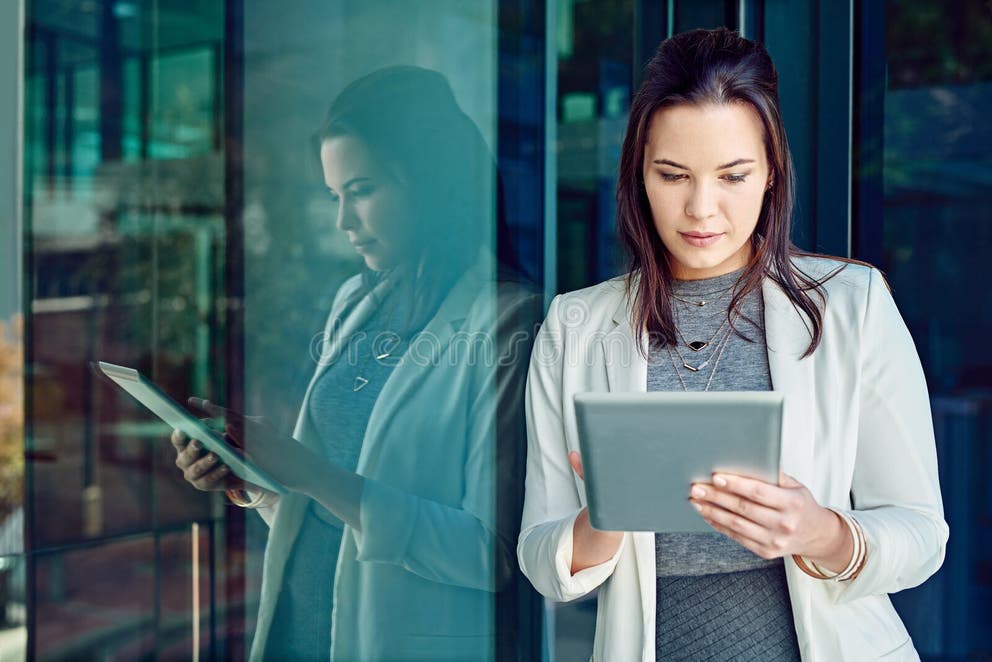 Getting More Work Done with Modern Technology. a Young Businesswoman ...