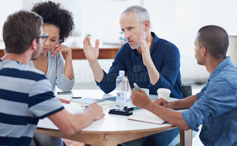 Getting into the Nitty Gritty of the Project. a Group of Designers at ...