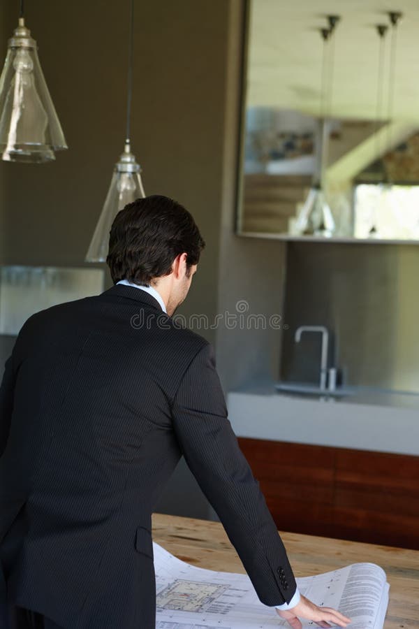 Getting the Plan Ready for Revising. Rear View Image of an Architect ...