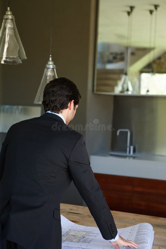 Getting the Plan Ready for Revising. Rear View Image of an Architect ...