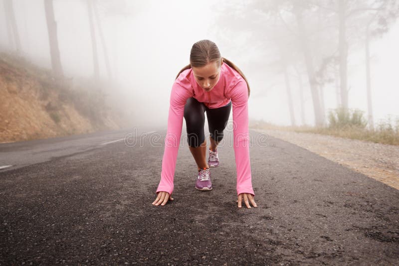 Getting Psyched for the Run. a Young Female Runner about To Start a ...