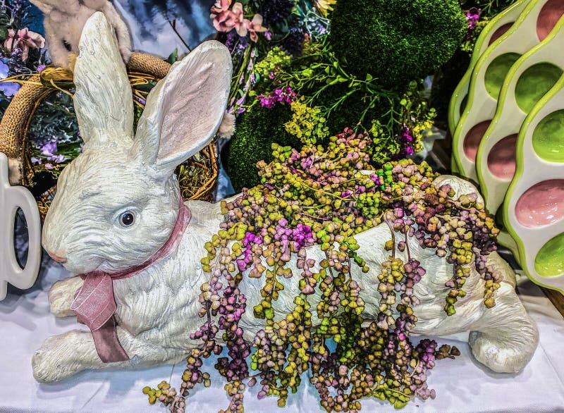 Bunny among the flowers stock image. Image of foot, gray - 1389553