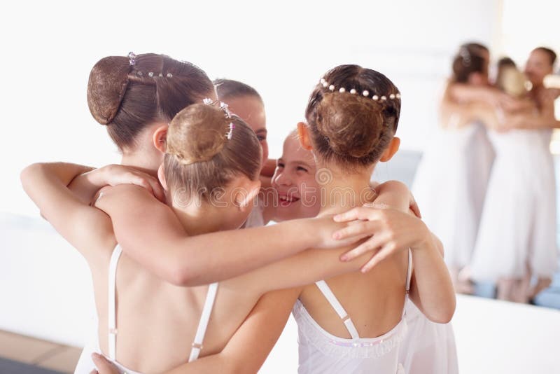 Getting Ready for the Performance. a Group Af Young Ballerinas Huddling ...