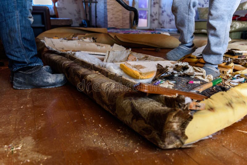 Getting Rid of Old Things. Disassembling an Old Sofa in the Attic ...