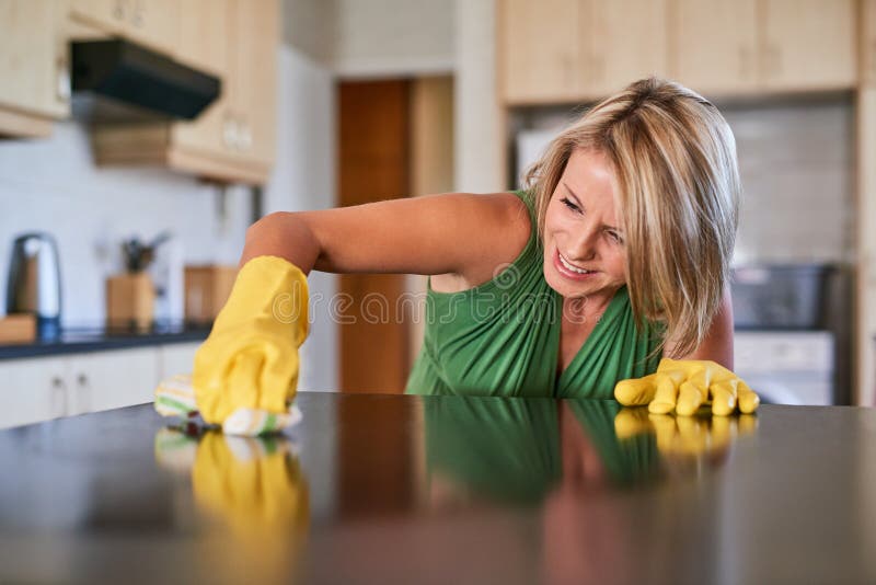 Getting Rid of Stubborn Stains. a Young Woman Cleaning a Kitchen ...