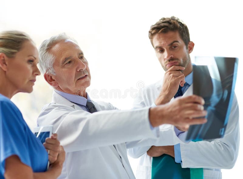 Getting Right Down To the Root Cause of the Problem. a Group of Medical ...