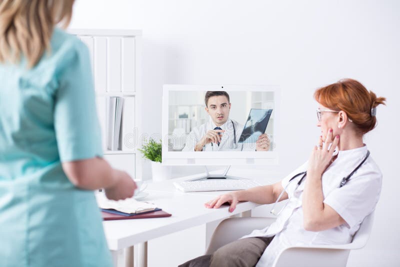 Getting a second opinion stock image. Image of professional - 71369313