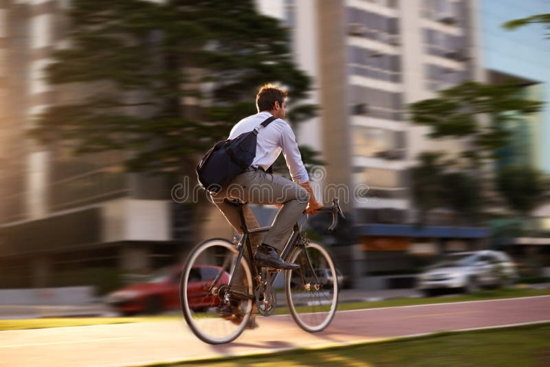 Getting Some Exercise on the Way To Work. a Businessman Commuting To ...