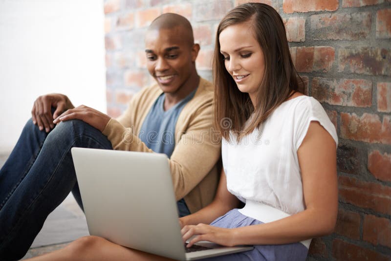 Getting Some Help with Her Project. Two Friends Sitting Together with a ...