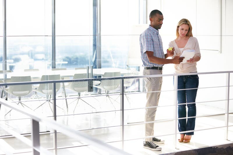 Getting Some Input from a Colleague. Two Business Colleagues Discussing ...