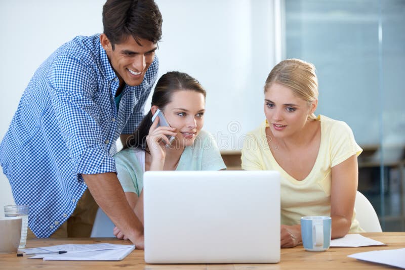 Getting Their Clients Approval. Three Colleagues Working in an Office ...