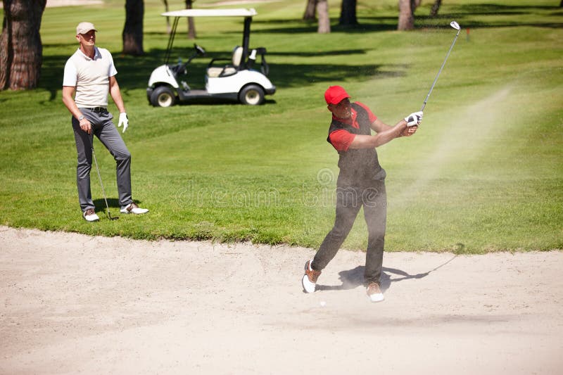 Getting Their Golf on. Two Handsome Men Playing a Game of Golf. Stock ...