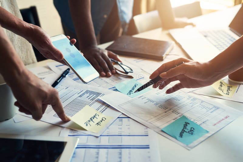 Getting Their Paperwork in Order. High Angle Shot of a Group of ...