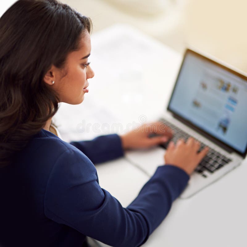 Getting Things Done One Task at a Time. a Young Businesswoman Working ...