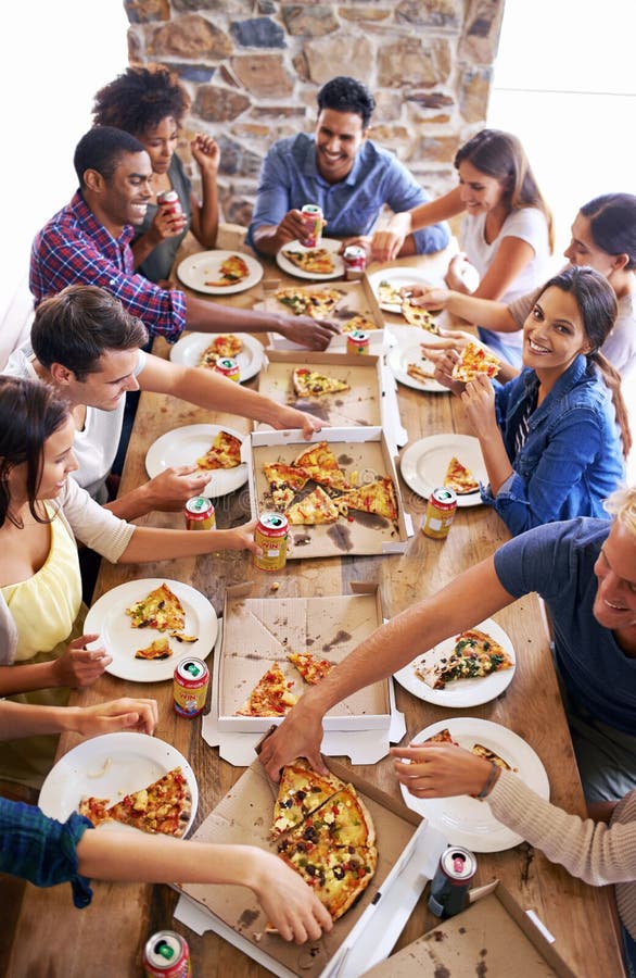 Getting Together for Pizza. Cropped Shot of a Group of Friends Enjoying ...