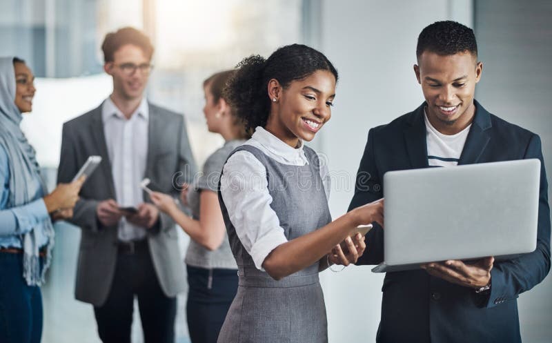 Getting Up To Work Things. a Group of Young Cheerful Businesspeople ...