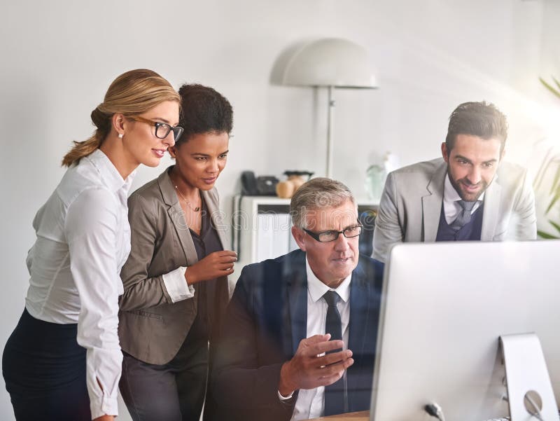 Getting the Whole Team in on the Project. Businesspeople Working ...