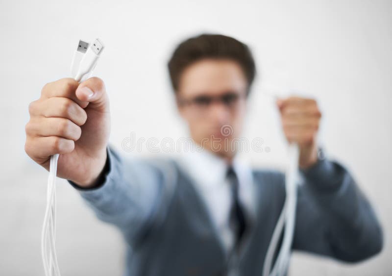 Getting Wired Up. a Young Nerdy Guy Holding Usb Cables Toward the ...