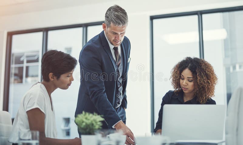 Getting the Work Done As a Team. a Group of Businesspeople Having a ...