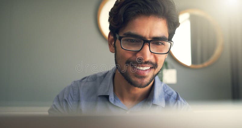 Getting Work Done Easily at Home. a Handsome Young Businessman Working ...