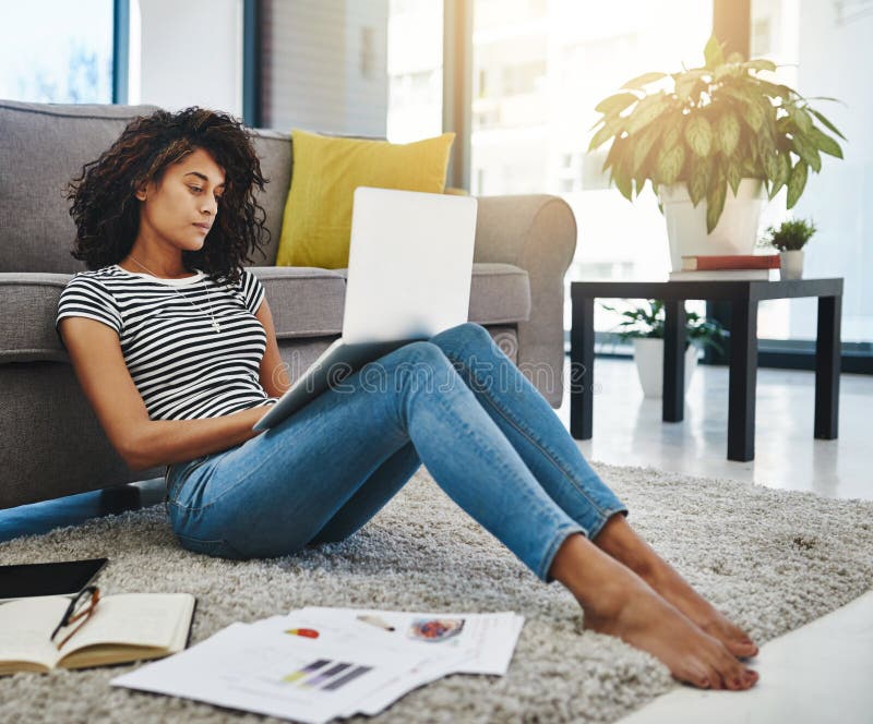 Getting Work Done at Home. a Young Woman Working from Home. Stock Photo ... Getting Work Done at Home. a Young Woman Working from Home. Stock Photo ...