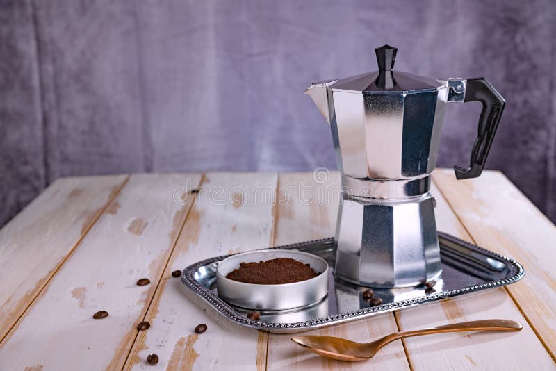 Geyser Coffee Maker and Ground Coffee on a White Kitchen Table Stock ...